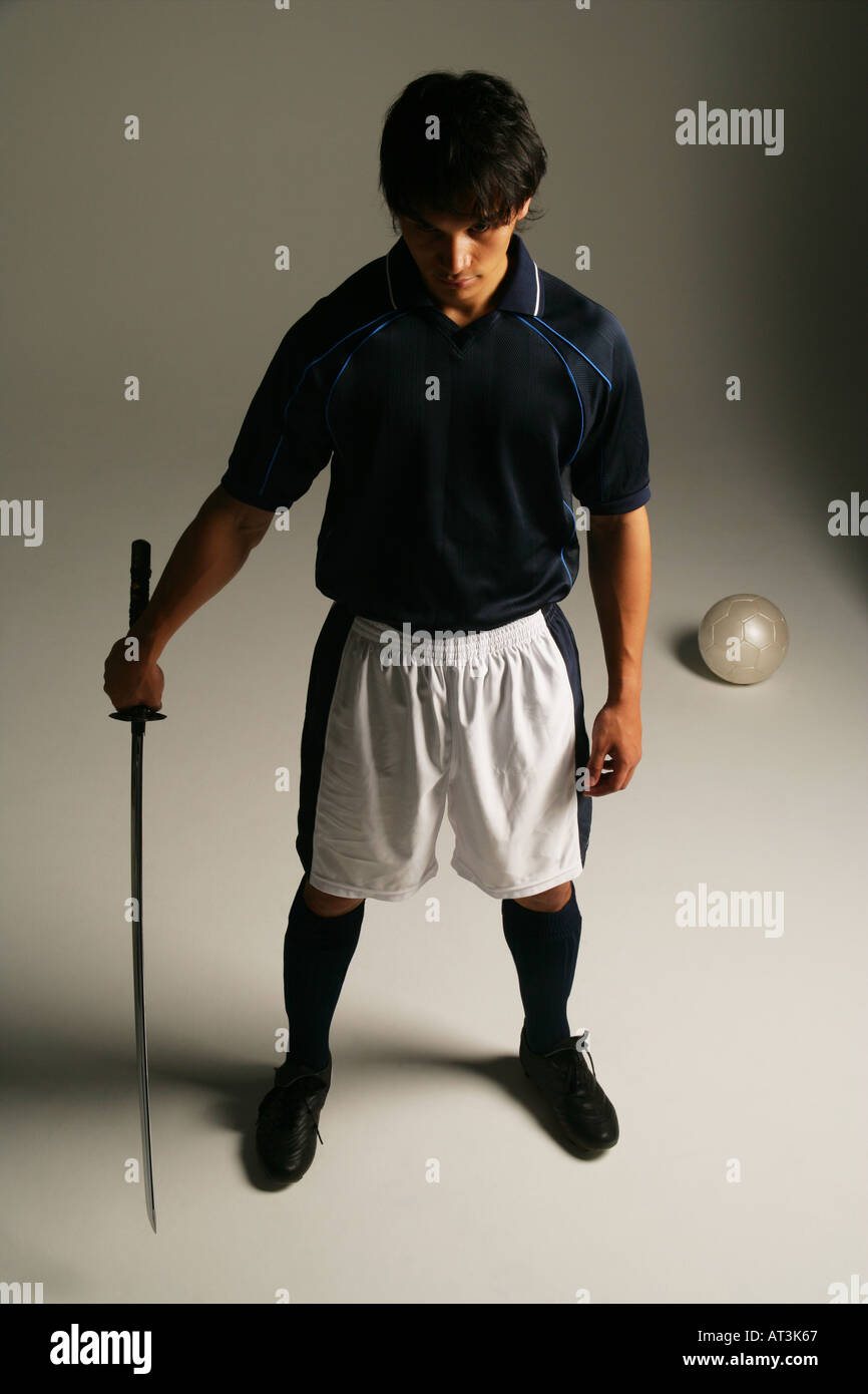 Soccer player with Japanese sword Stock Photo - Alamy