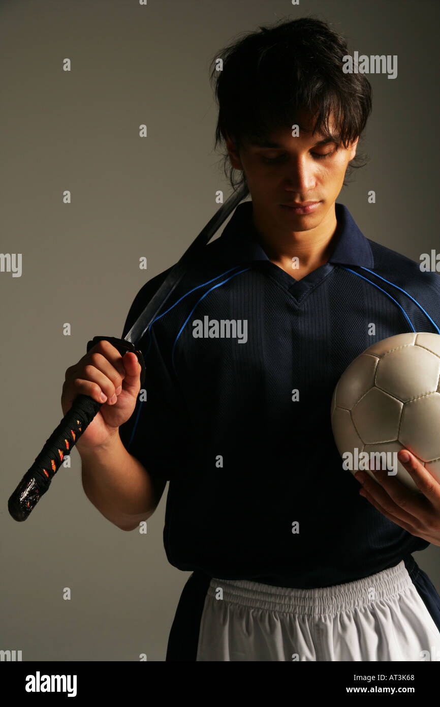 Soccer player with Japanese sword Stock Photo - Alamy