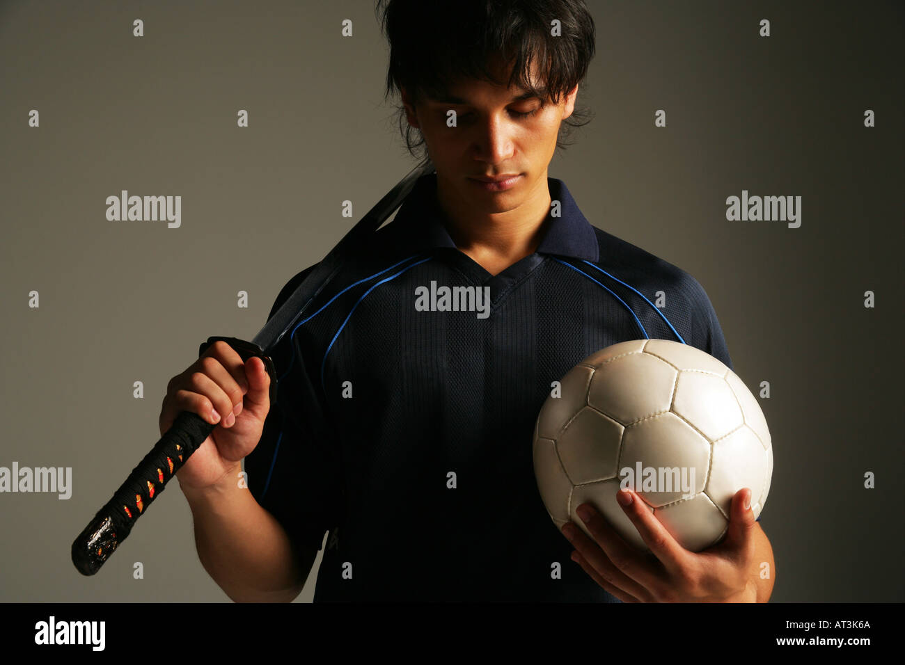 Soccer player with Japanese sword Stock Photo - Alamy