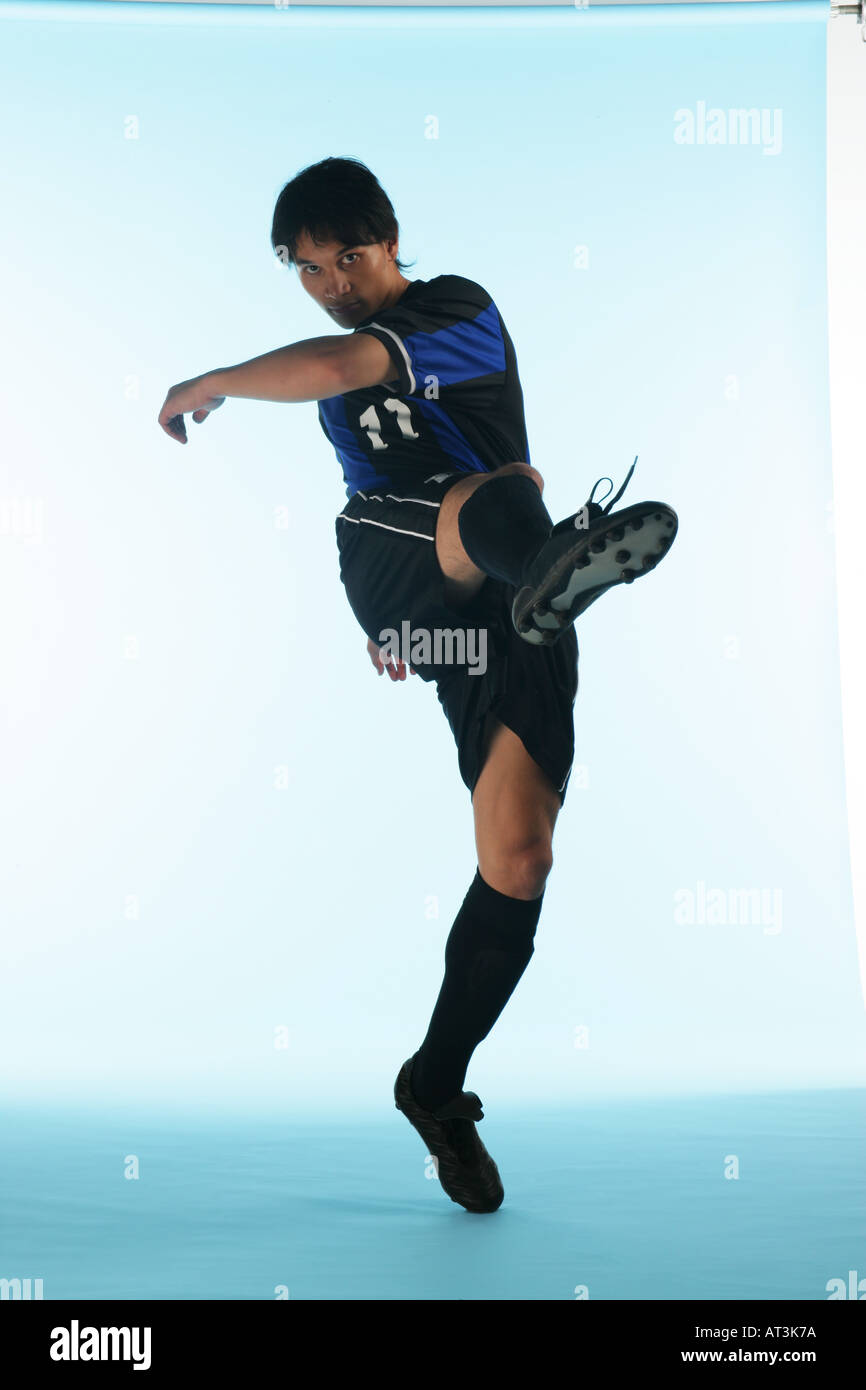 Soccer player shooting Stock Photo - Alamy