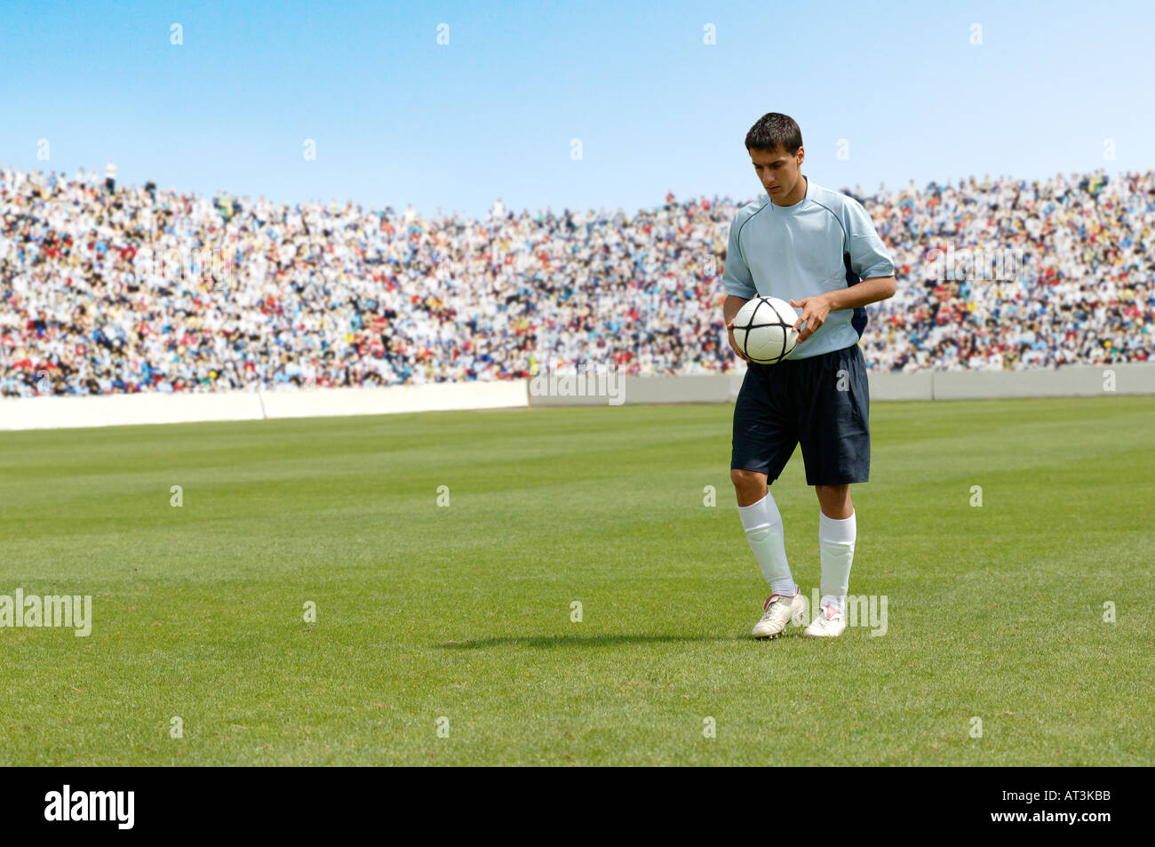 Soccer player lining up free kick Stock Photo - Alamy
