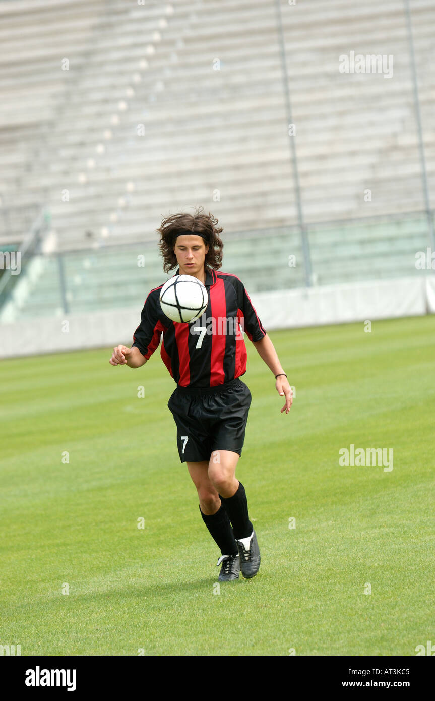 Soccer player juggling ball Stock Photo - Alamy