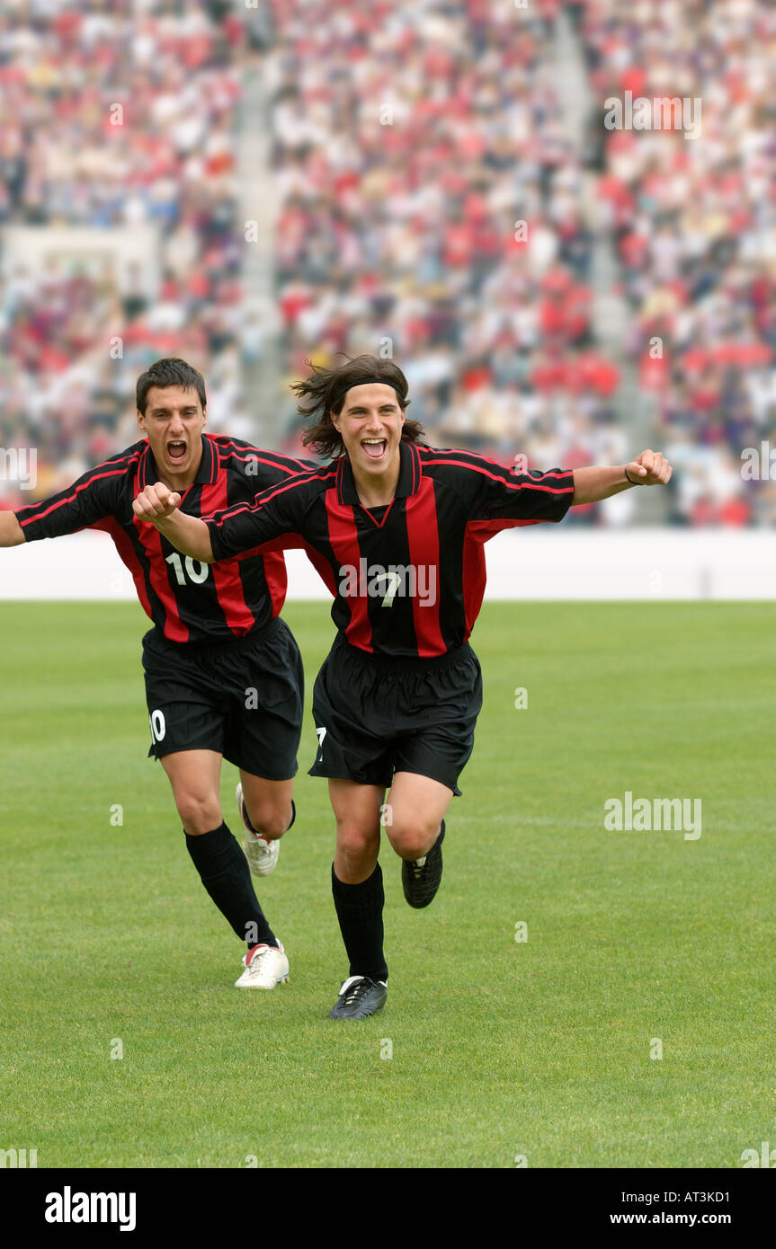 Two teammates celebrating Stock Photo - Alamy