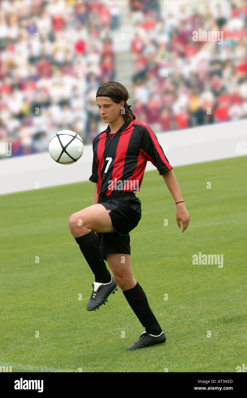 Soccer player juggling ball Stock Photo - Alamy