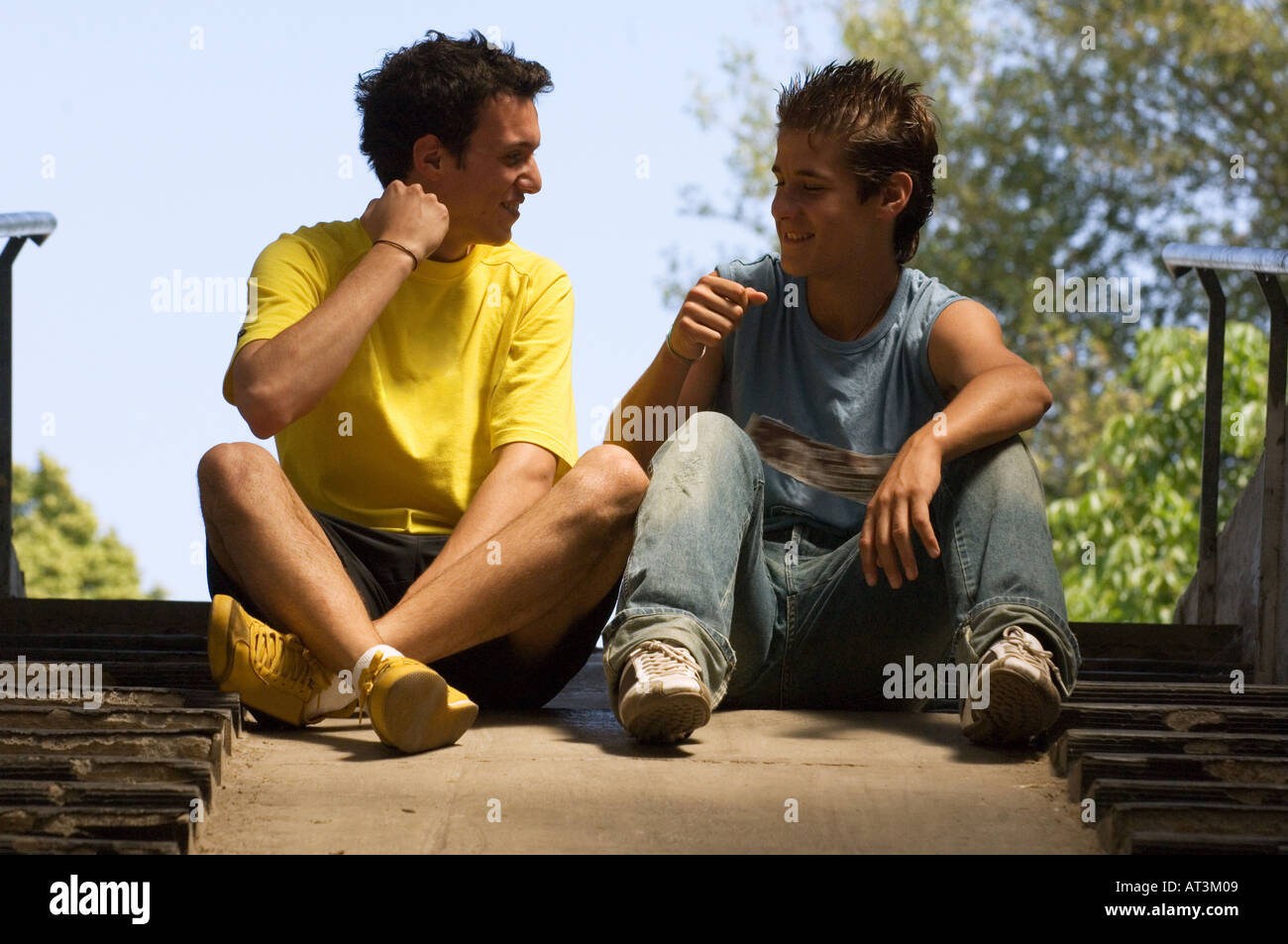 Teenage boys chatting on steps Stock Photo - Alamy