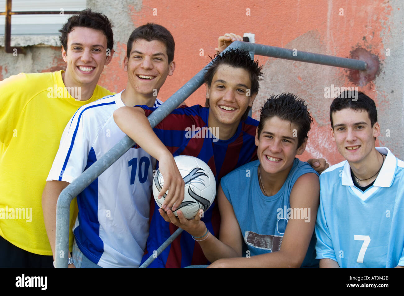 Group of teenage soccer friends on steps Stock Photo - Alamy