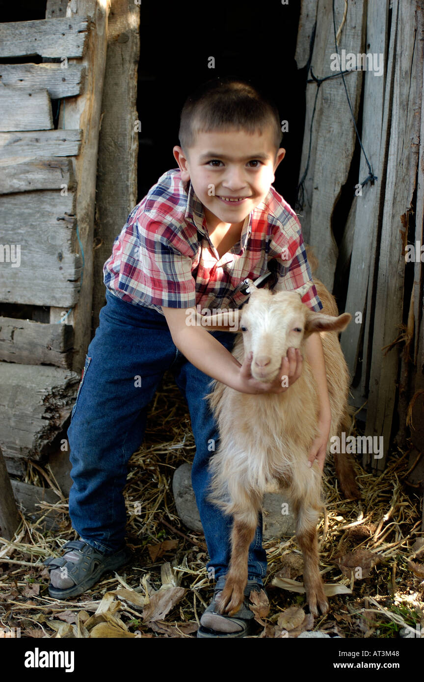 kid with the goat Stock Photo - Alamy