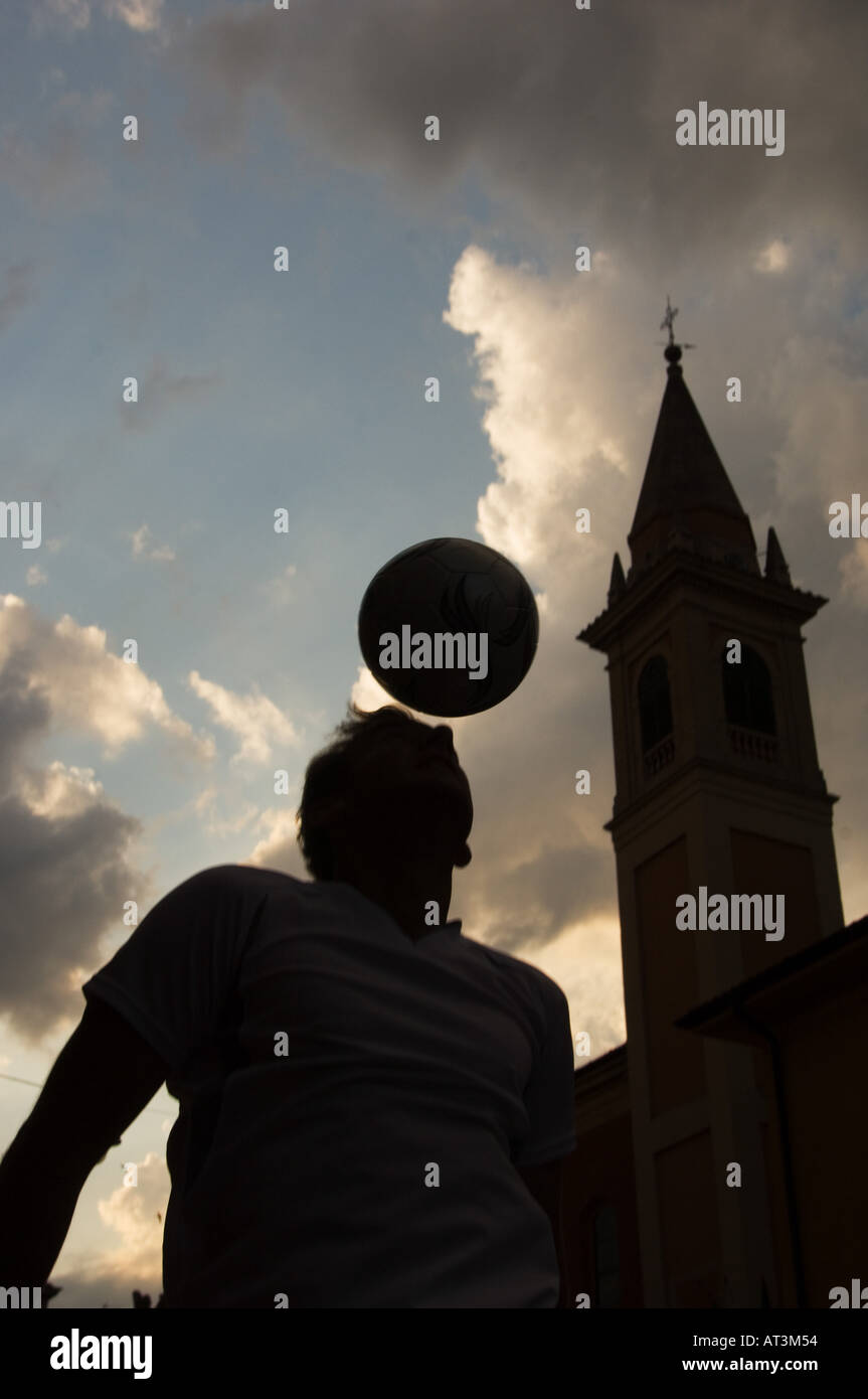 Silhouette of man juggling ball on head Stock Photo - Alamy