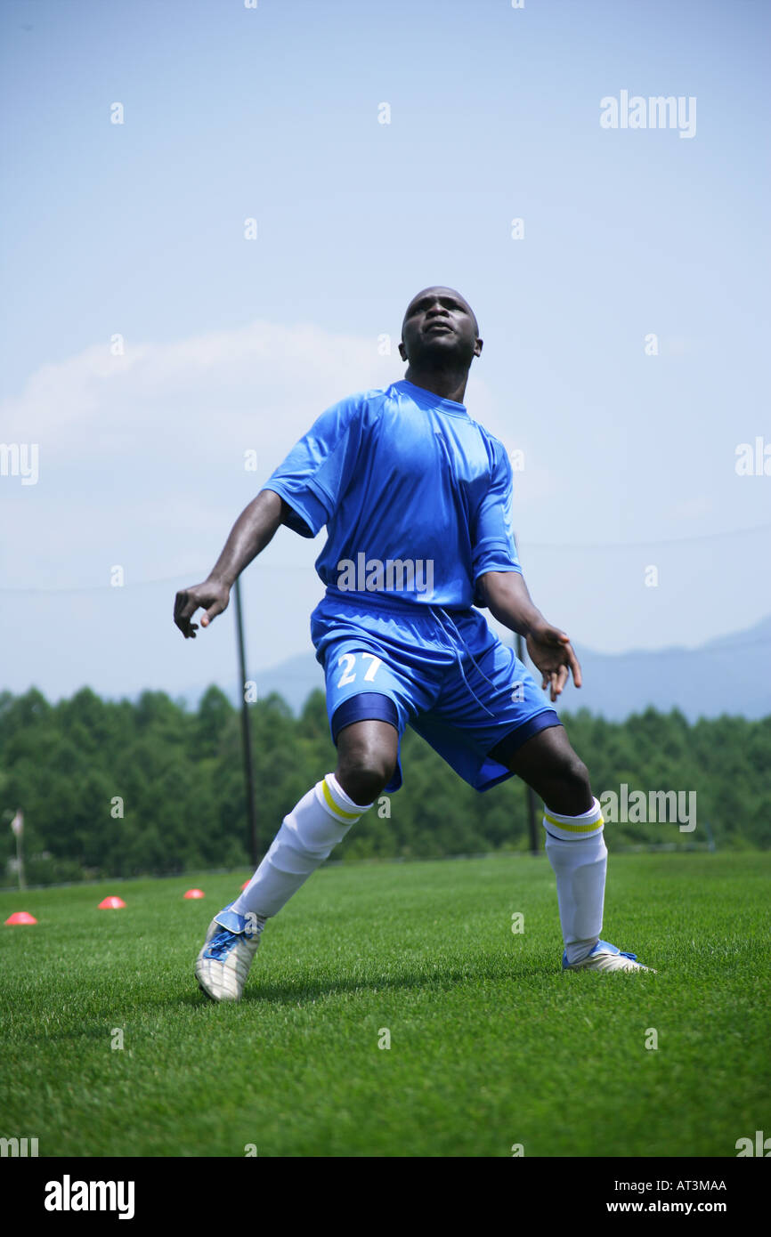 Soccer player juggling ball Stock Photo - Alamy