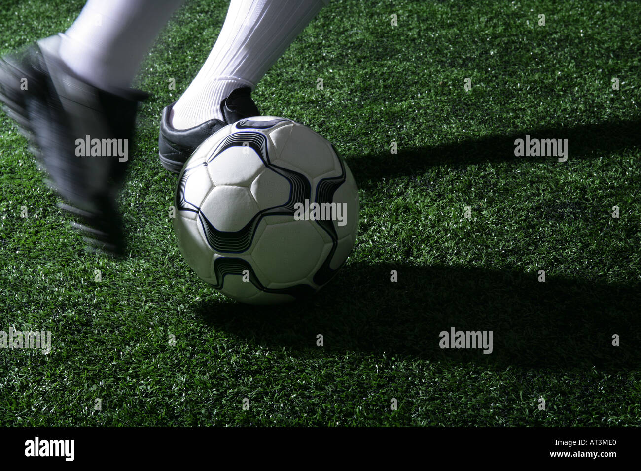 Shadow foot kicking football hi-res stock photography and images - Alamy
