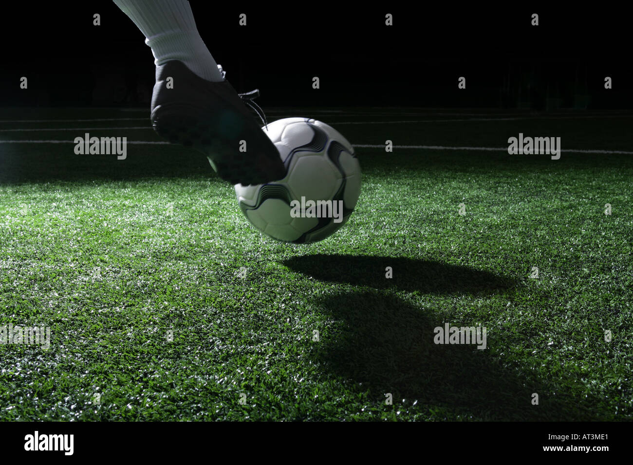 Shadow foot kicking football hi-res stock photography and images - Alamy