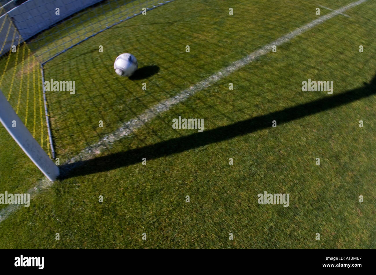 Soccer ball in goal Stock Photo - Alamy