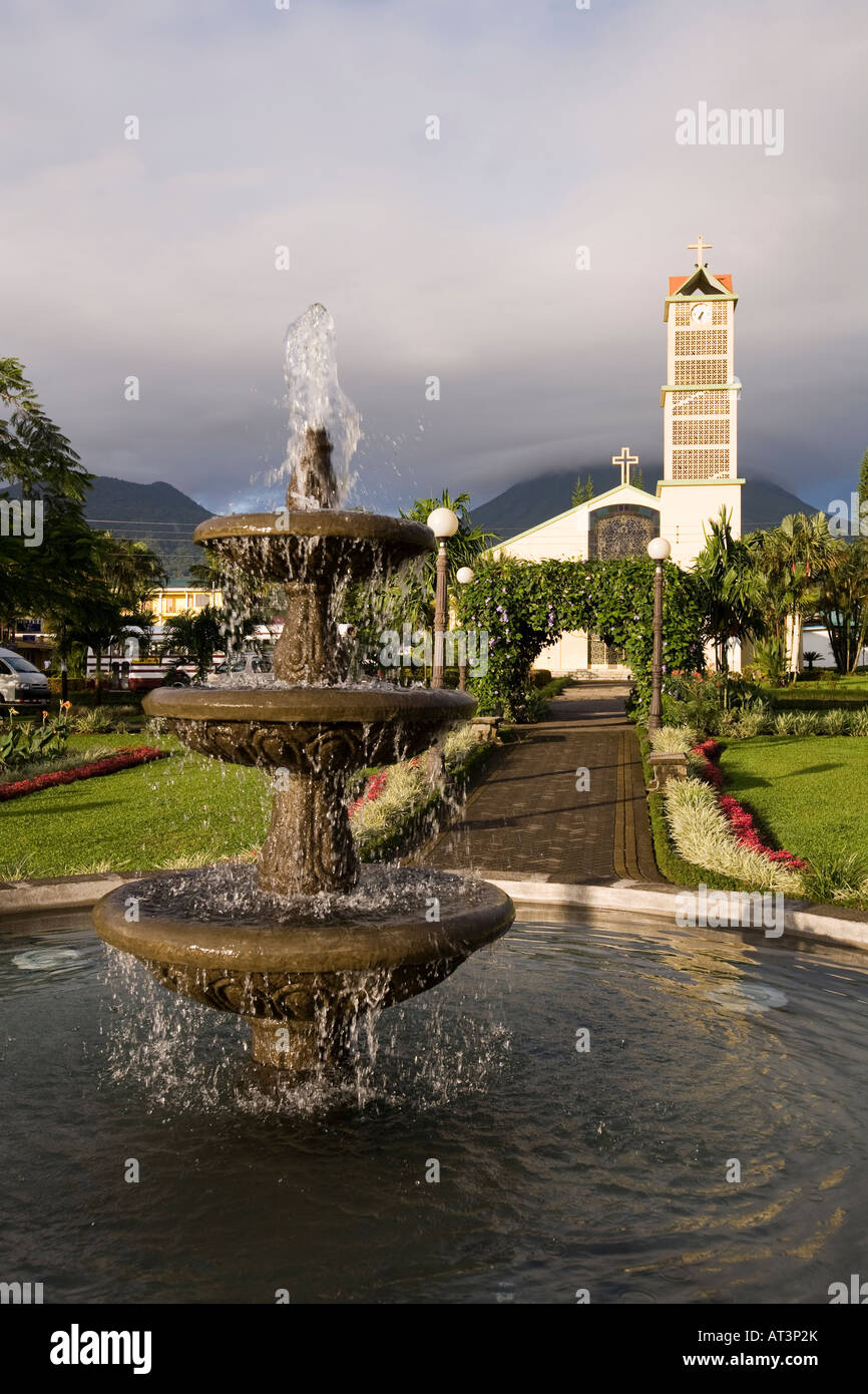 Costa Rica La Fortuna Parque Central Park fountain and church with ...