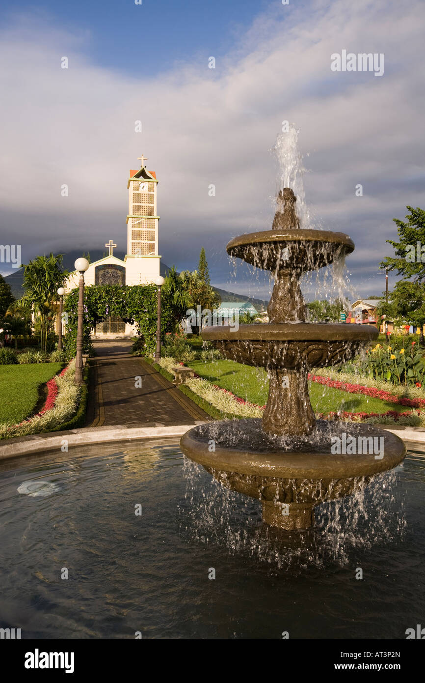 Costa Rica La Fortuna Parque Central Park fountain and church with ...