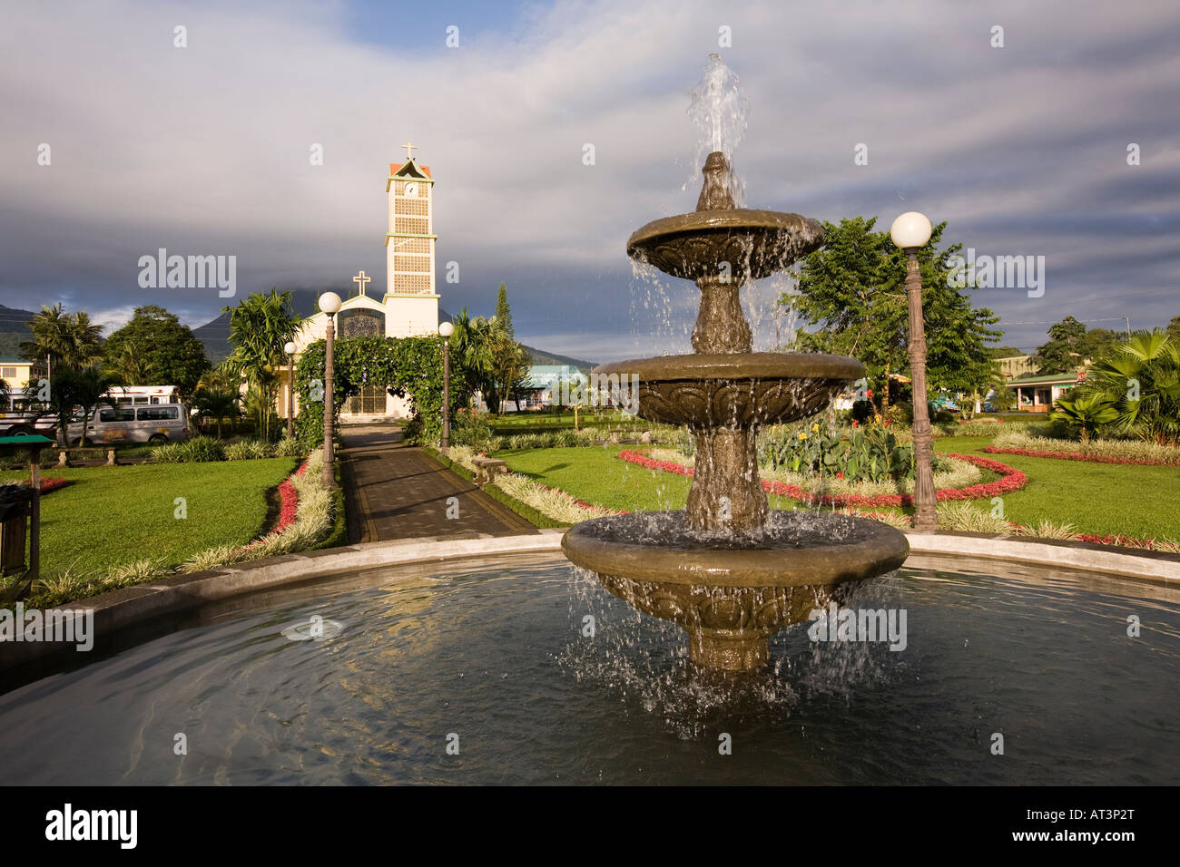 Costa Rica La Fortuna Parque Central Park fountain and church with ...