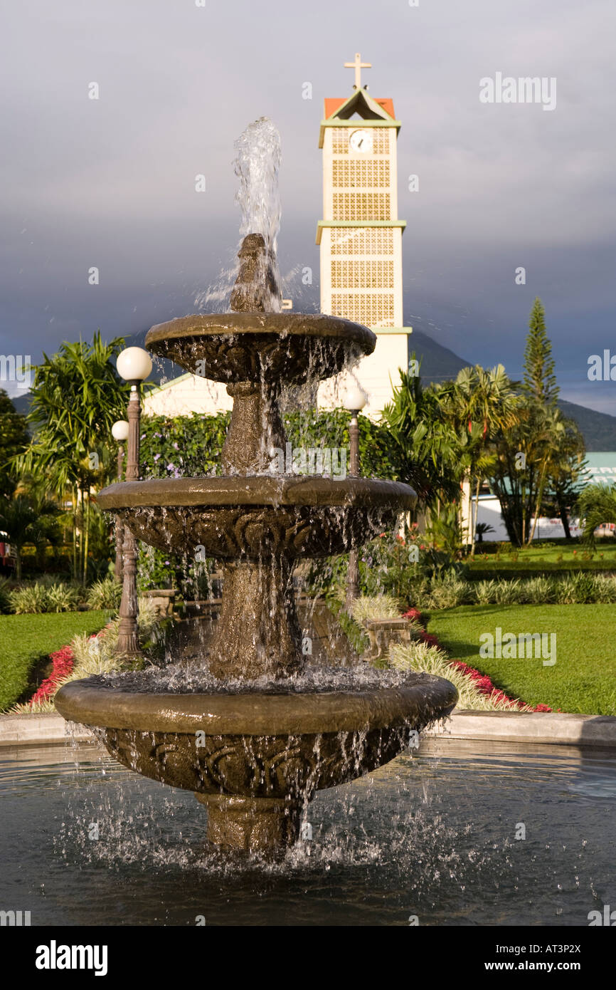 Costa Rica La Fortuna Parque Central Park fountain and church with ...