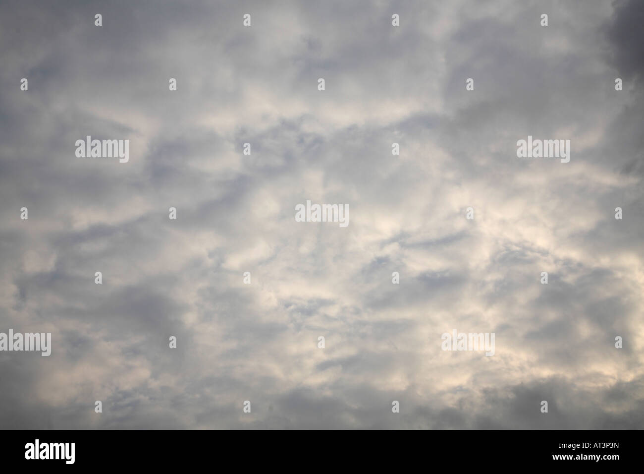 Altocumulus perlucidus Mass of folding white clouds with portions of ...