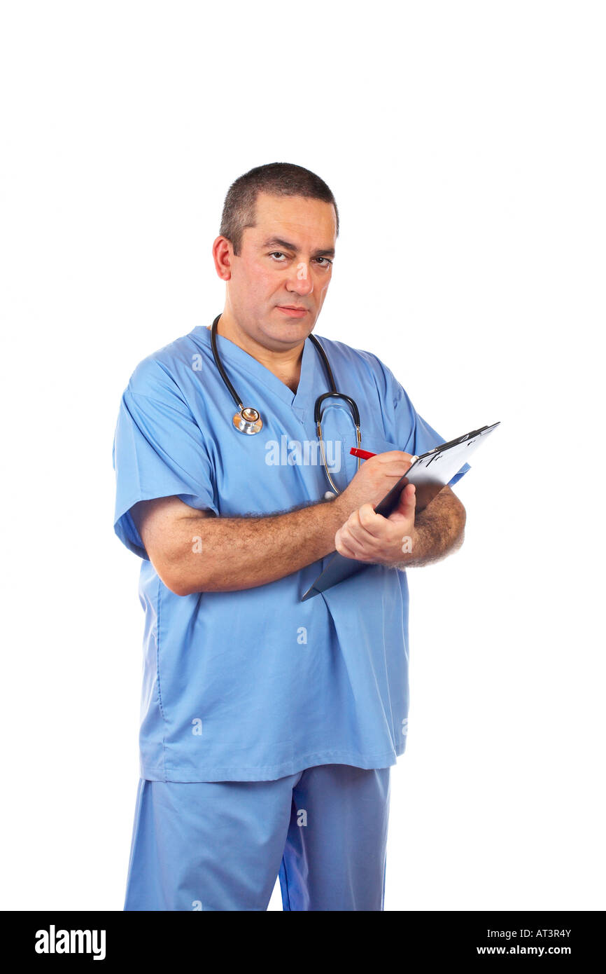Friendly male doctor in blue scrubs writing on white background Stock ...