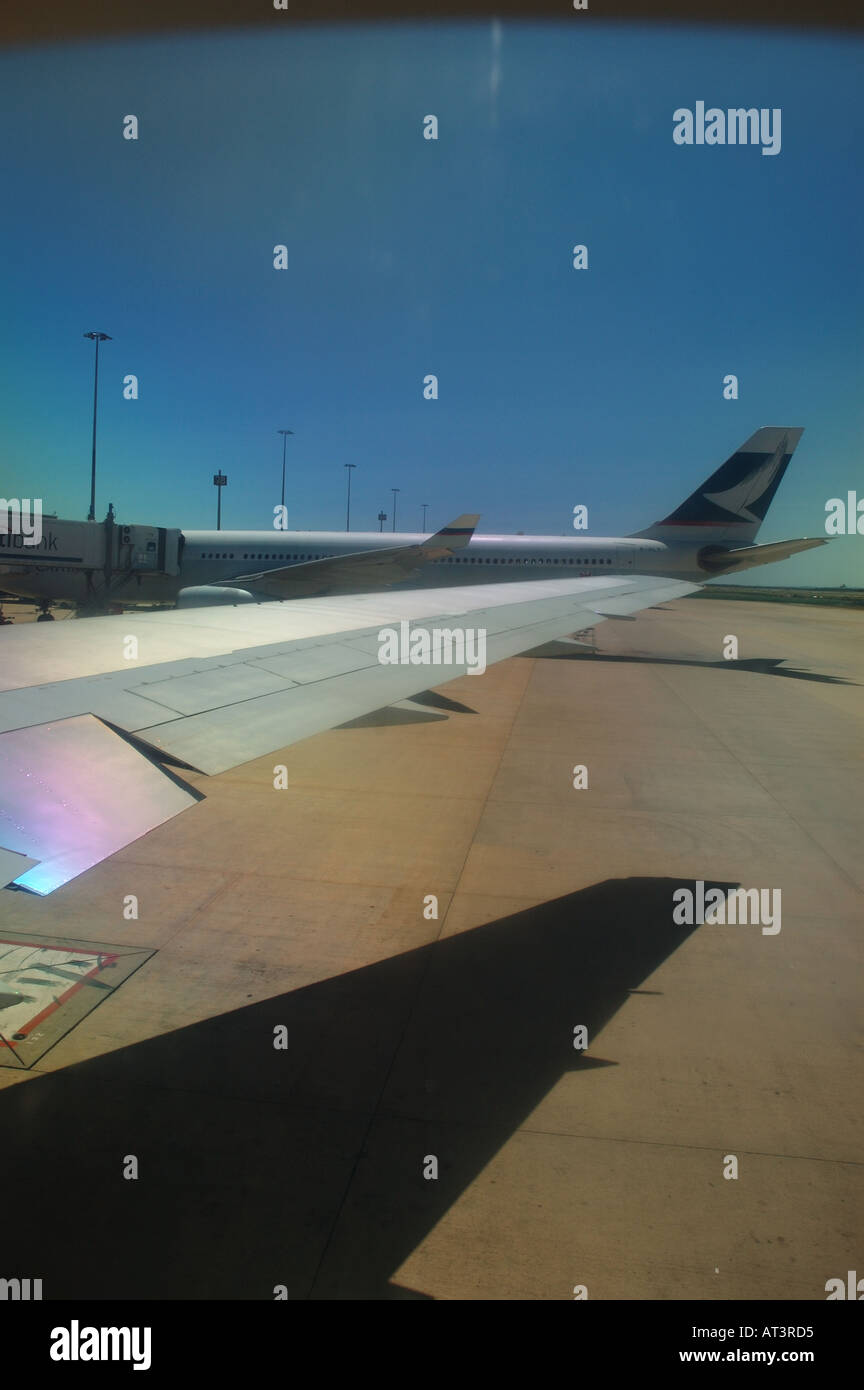 Airplane wing on tarmac Stock Photo - Alamy