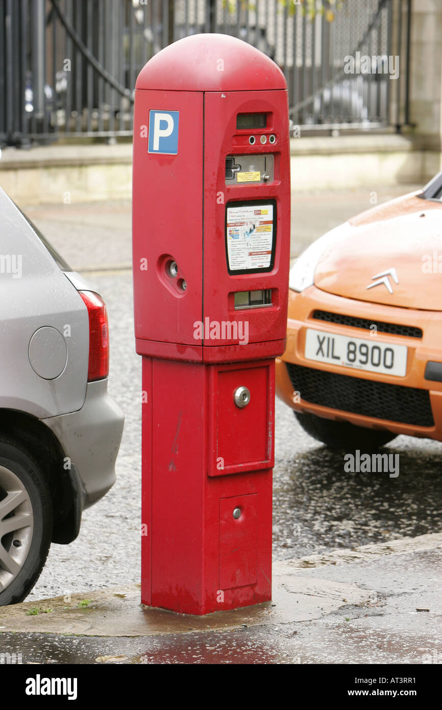 red pay and display parking meter ticket issuing machine on the ...