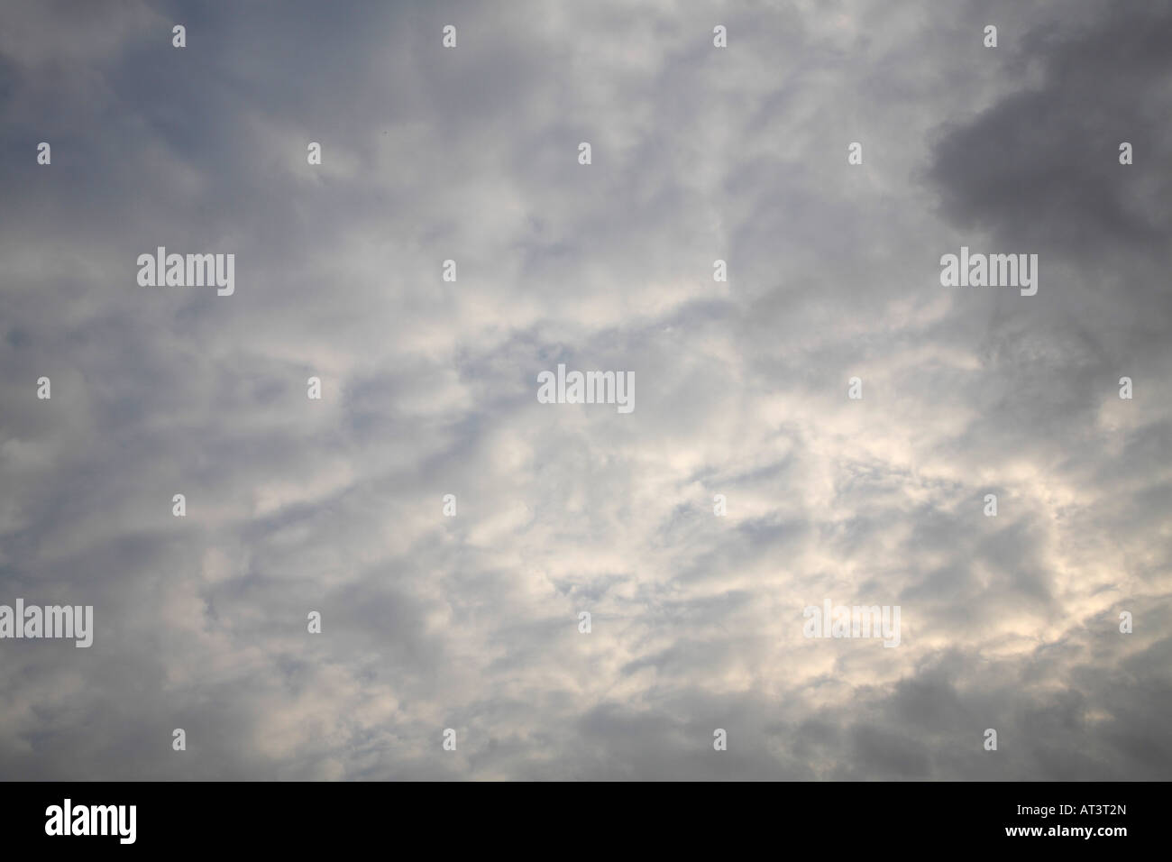 Altocumulus perlucidus Broken mass of white cloulds with a little blue ...