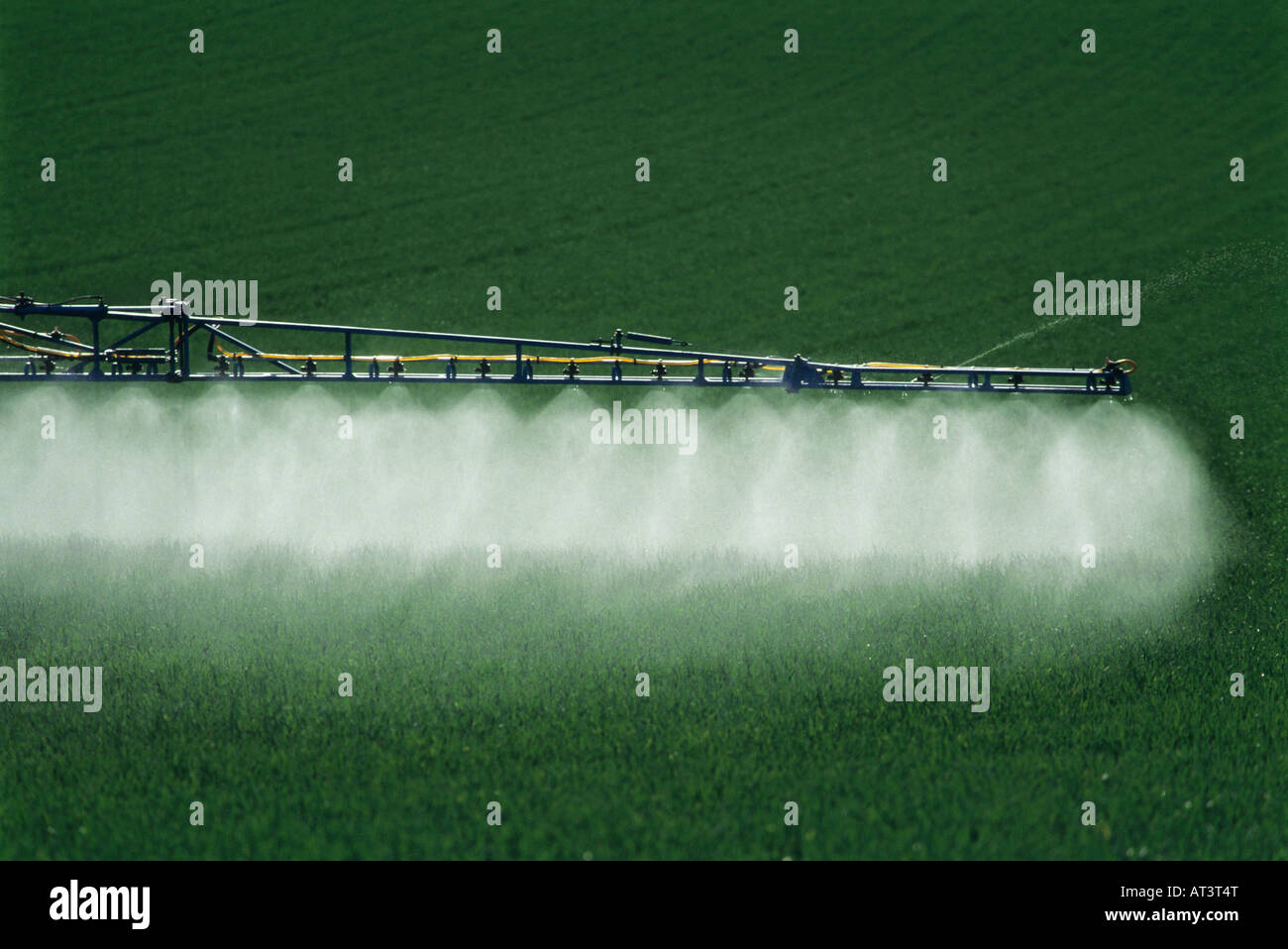 Crop spraying fertilizer Stock Photo - Alamy