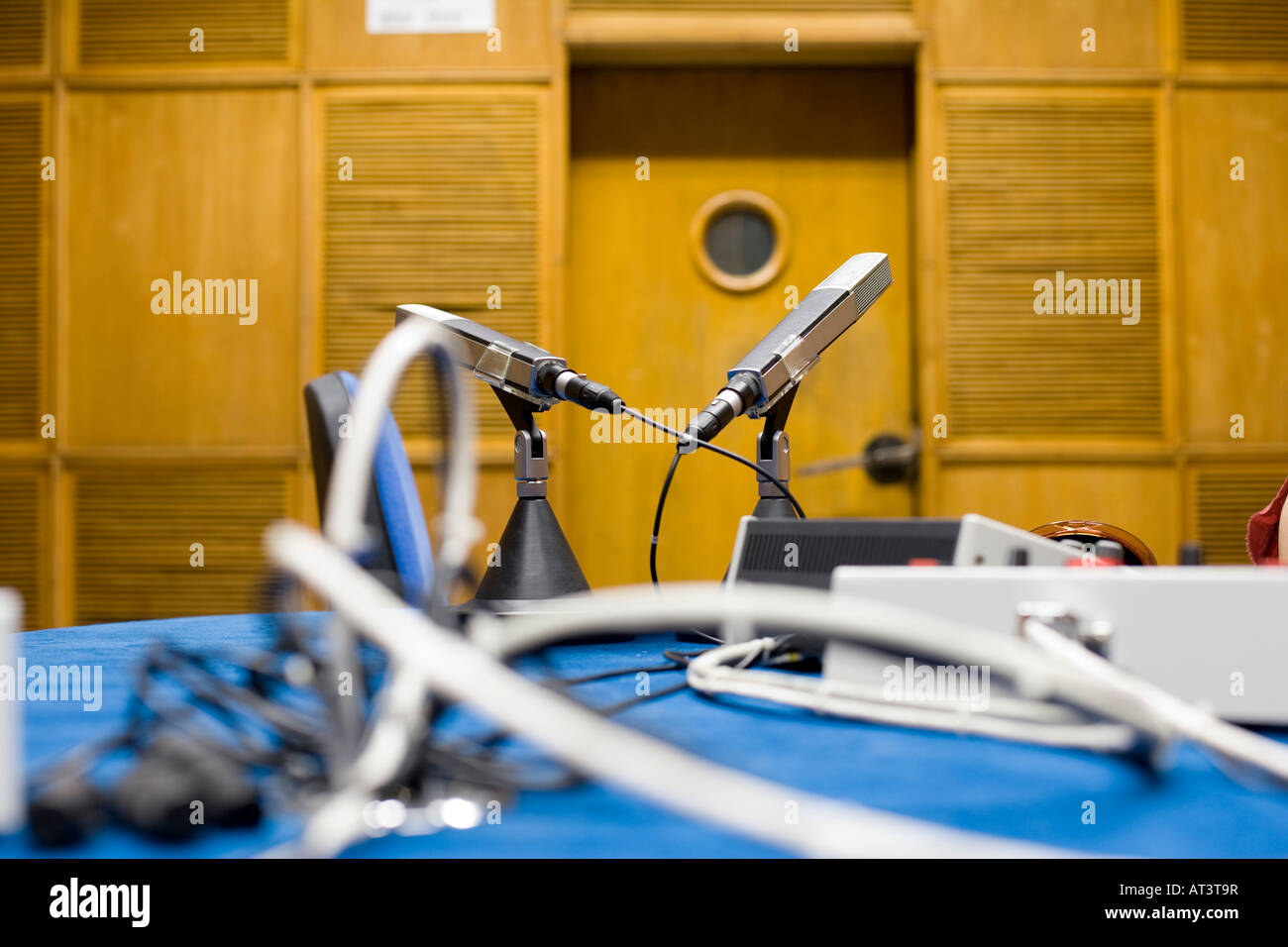 two microphones on a table with many wires Stock Photo - Alamy