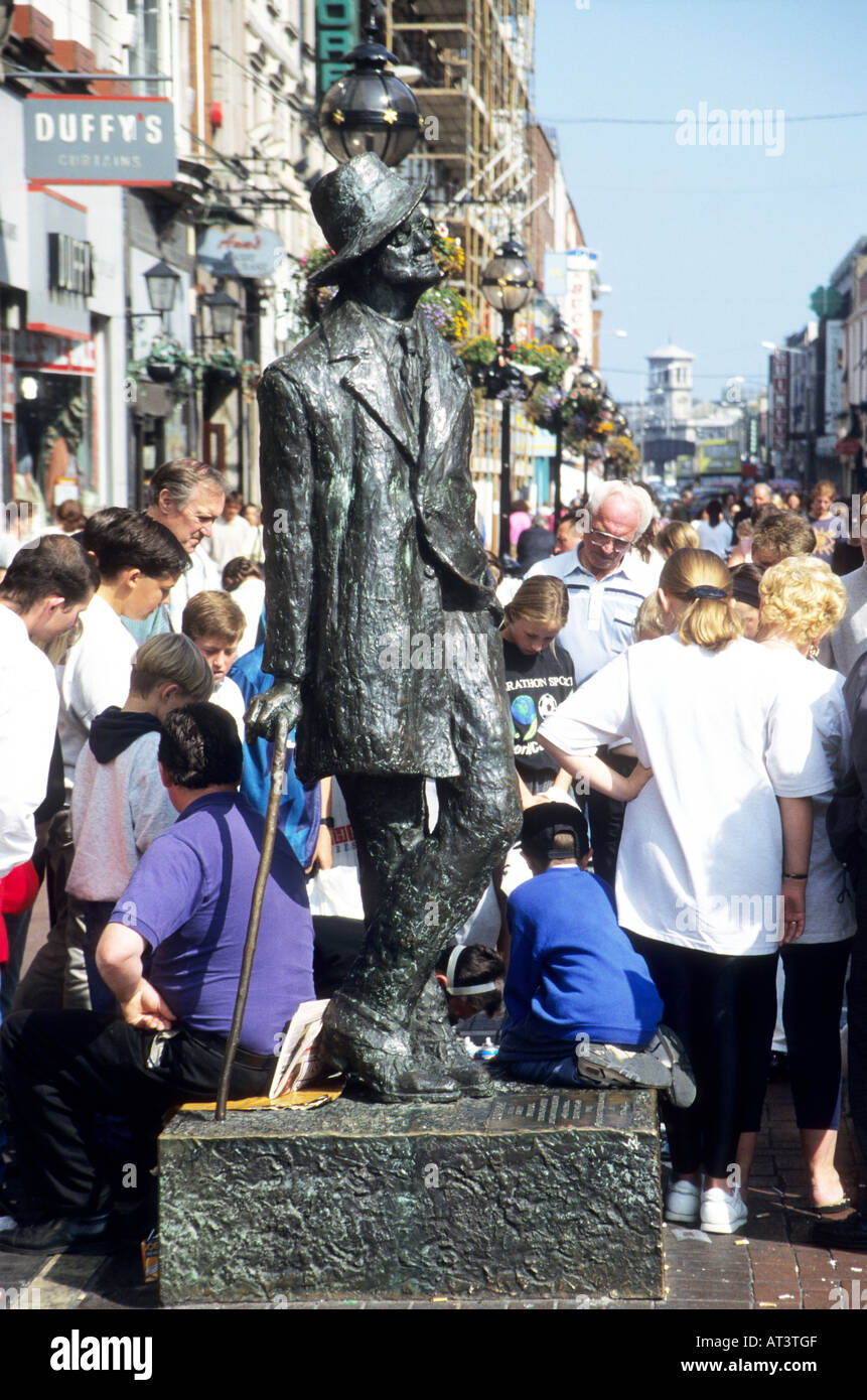 Sculpture of James Joyce in Dublin surrounded by shoppers and tourists ...