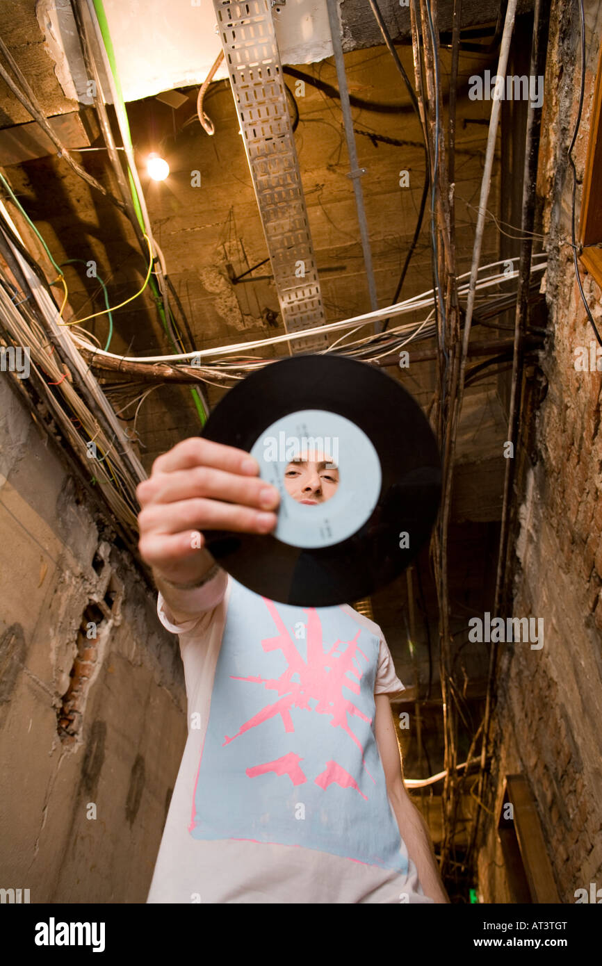 man looking through a old generation compact disk Stock Photo - Alamy