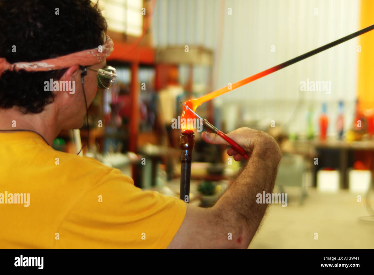 Glass artist cutting glass with snips ready for blowing Sunshine coast ...