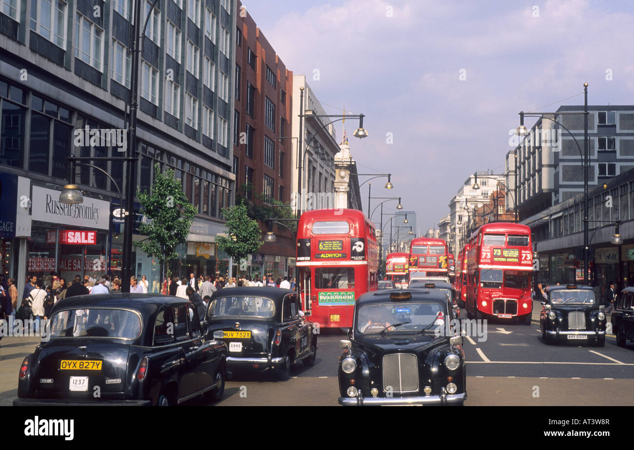 Oxford Street red busses black taxis London shops shopping England UK ...