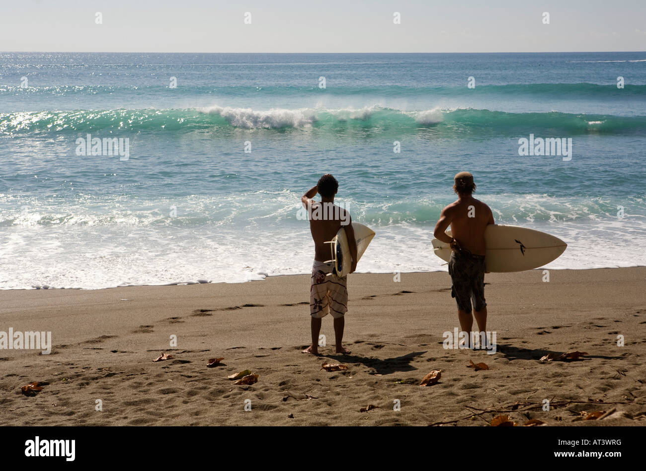 Costa Rica Osa Peninsula Cabo Matapalo Matapalo Beach two surfers on ...