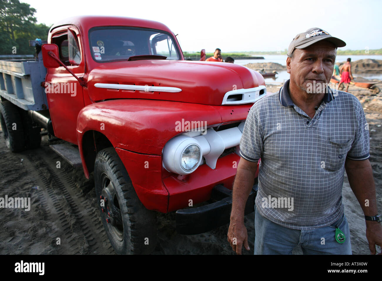 Poor people dig sand from the bottom of the river and transport it with ...