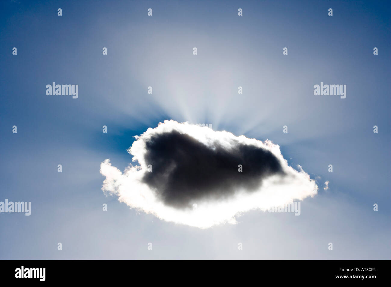 Dramatic bright sky with sun shining through a dark rain cloud Stock ...