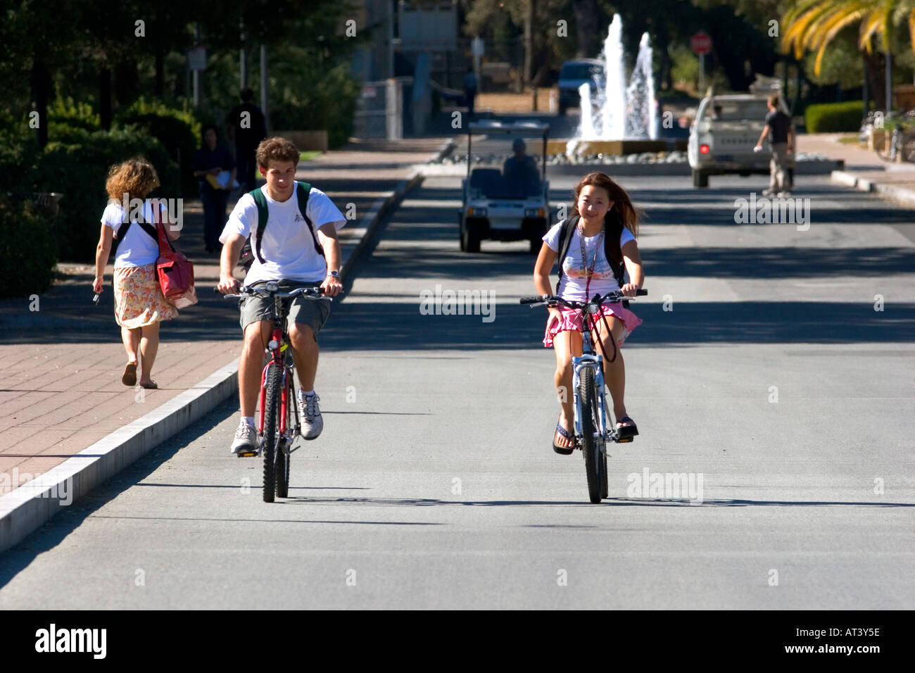 Students ride bicycles on the campus at Stanford University in Palo ...