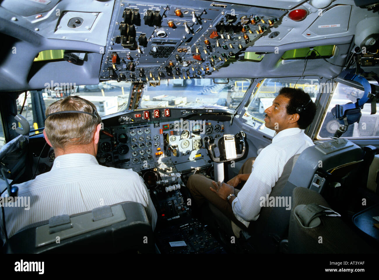 Pilot and co-pilot in the cockpit of a DC-10 commercial airplane Stock ...