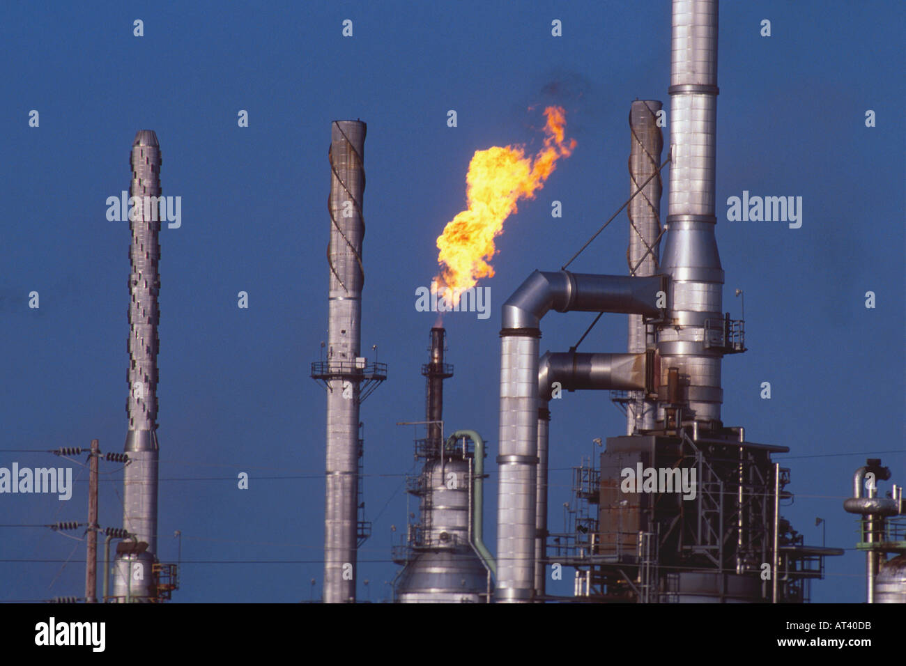 An oil refinery with gas flame Stock Photo - Alamy