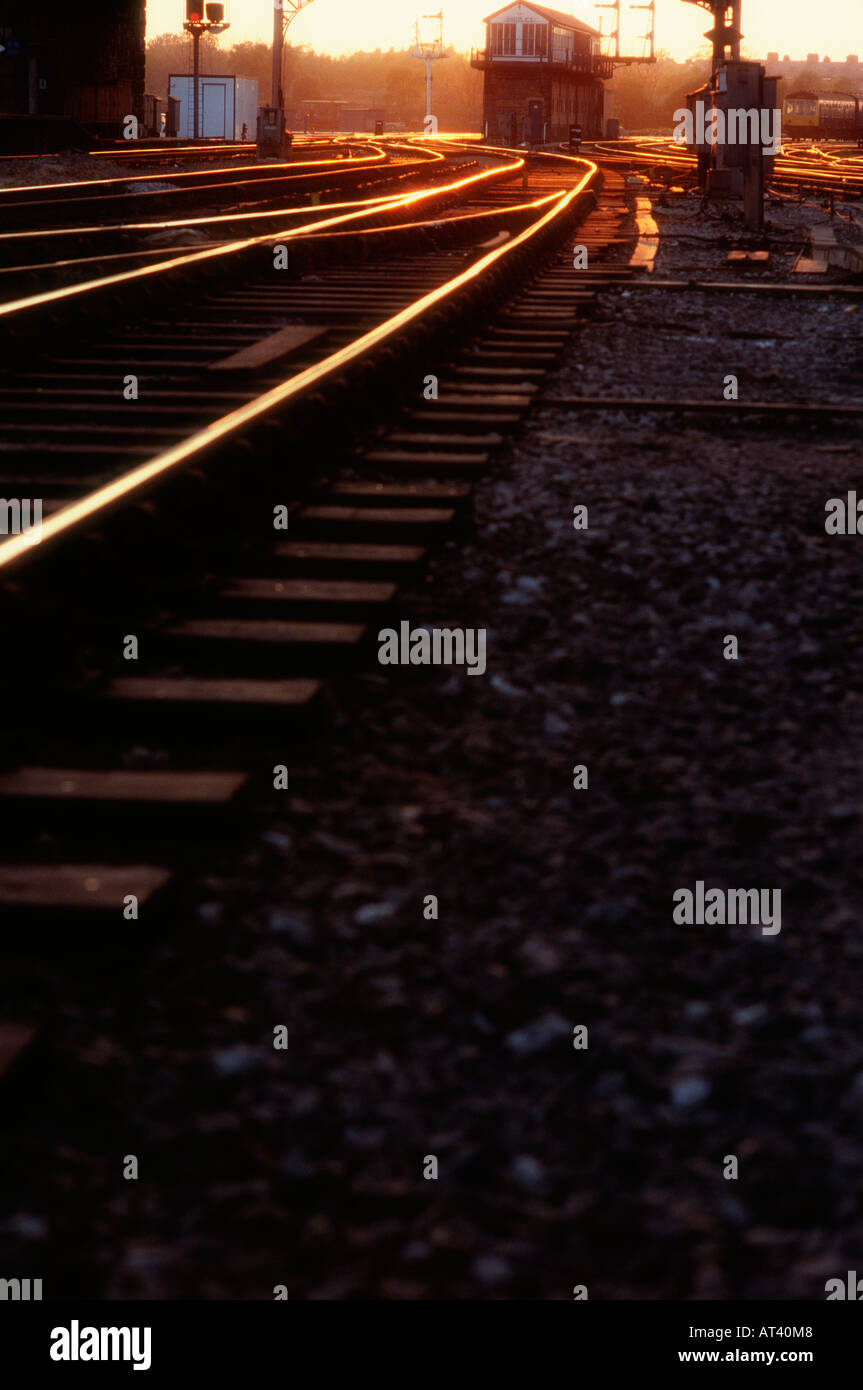 Railway lines with signal box at sunset Stock Photo - Alamy