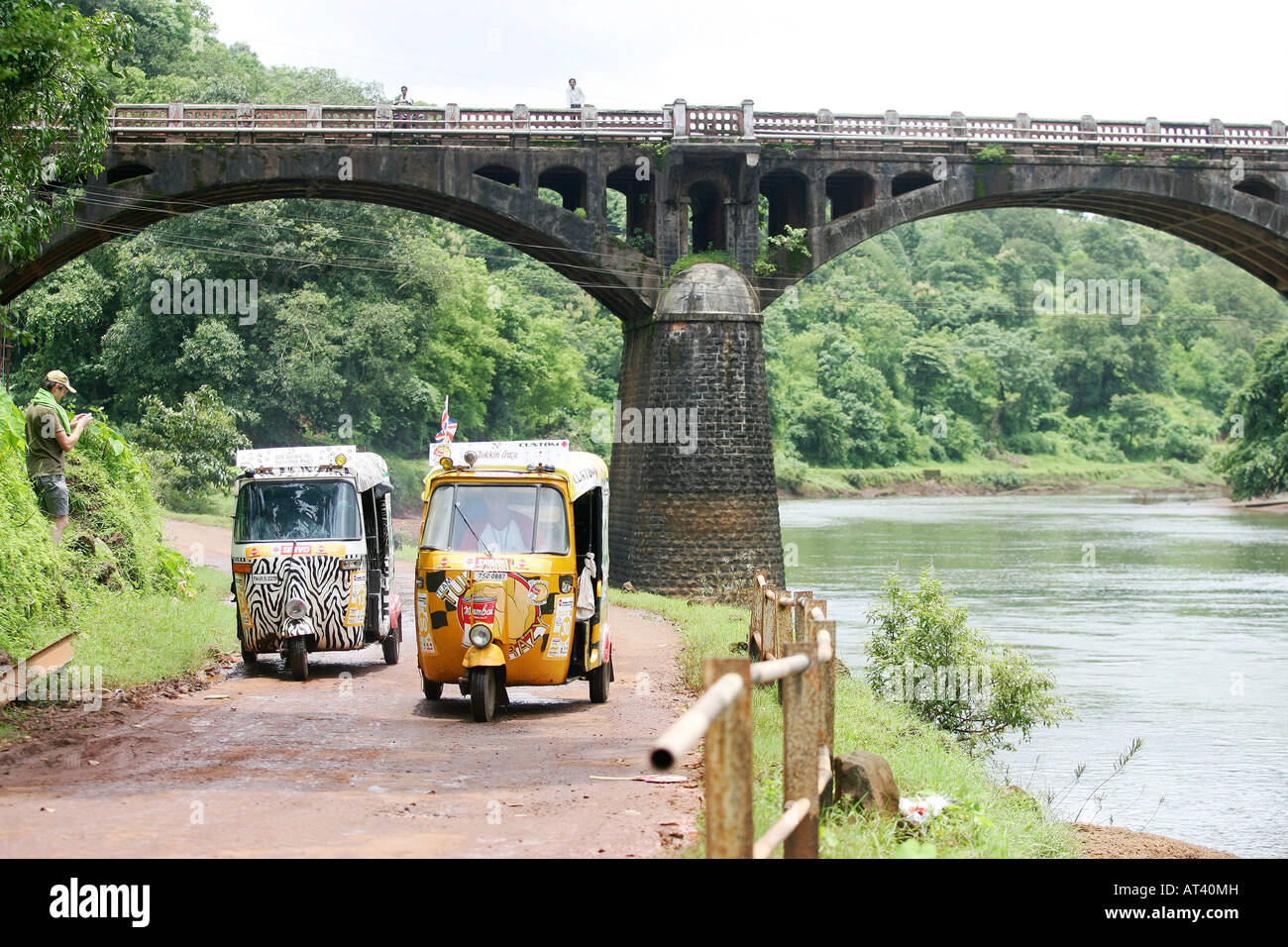 Two rickshaws by the side of a river in india during a rickshaw ...
