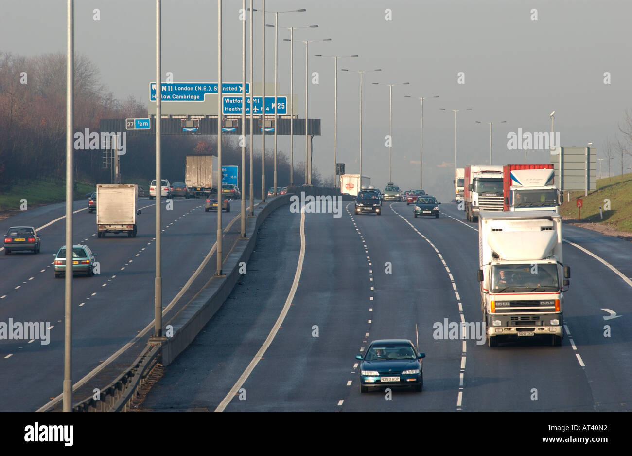 Motorway showing traffic lanes and central crash barrier Stock Photo ...