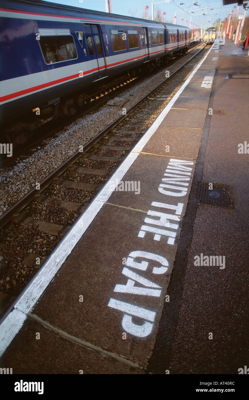 Railway station platform with train Stock Photo - Alamy
