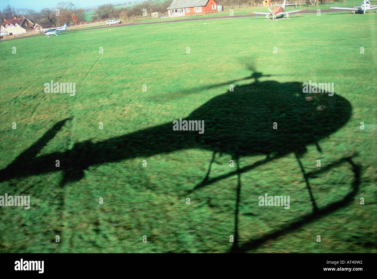 Helicopter shadow on grass Stock Photo - Alamy