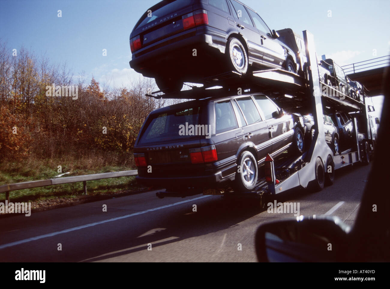 Car transporter on road Stock Photo - Alamy