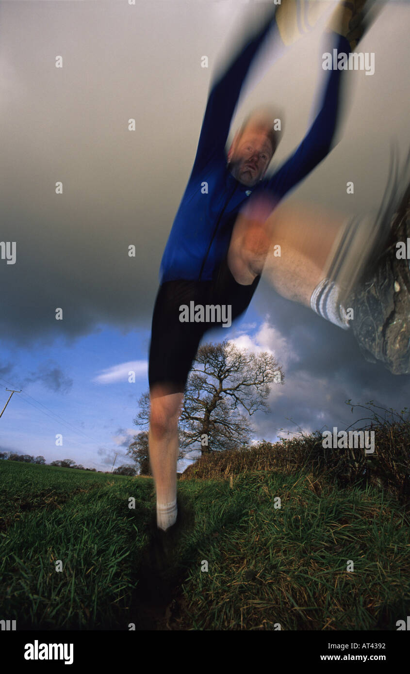 Man running over countryside hi-res stock photography and images - Alamy