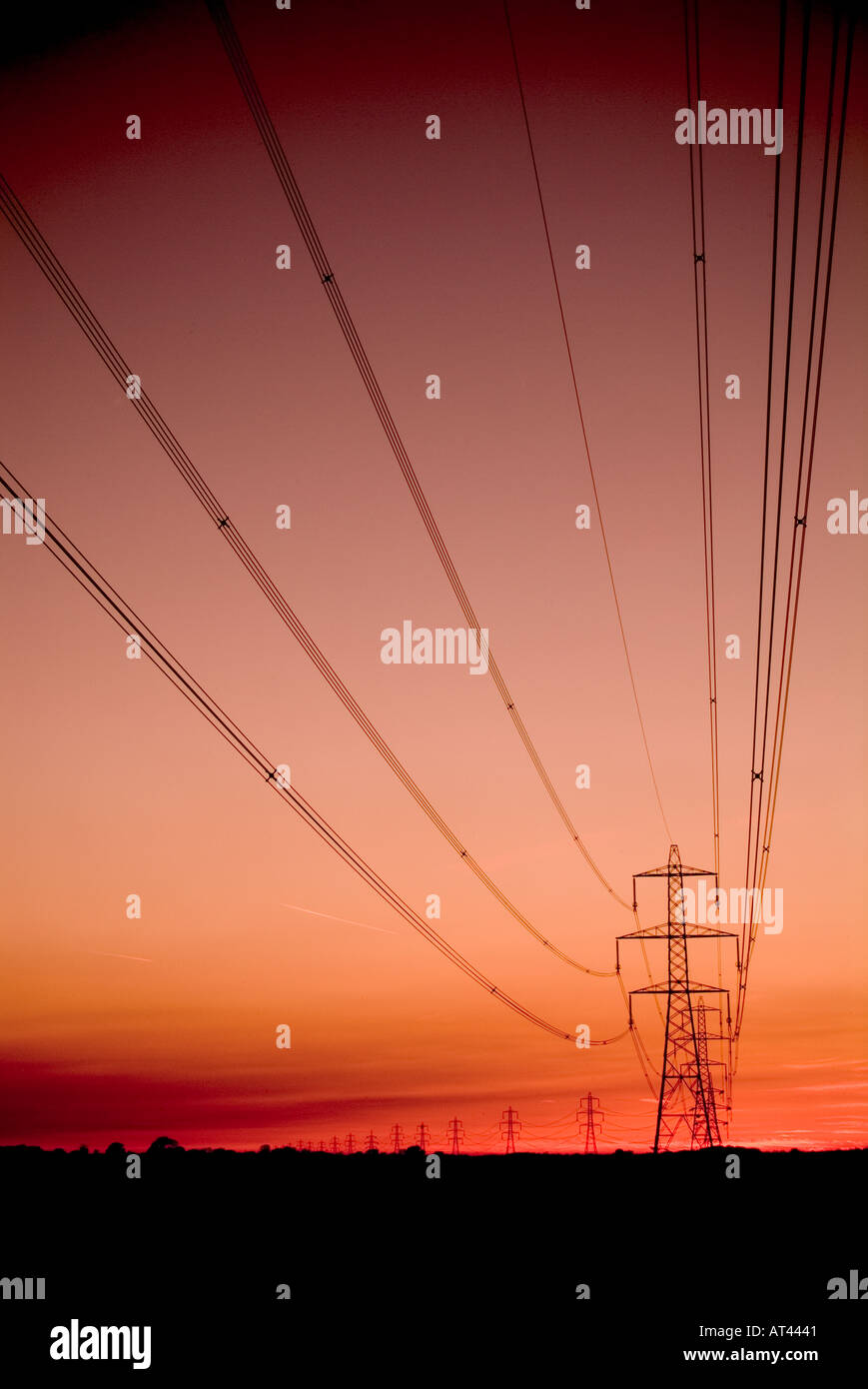 electricity pylons at sunset distribution national grid ac dc electric ...