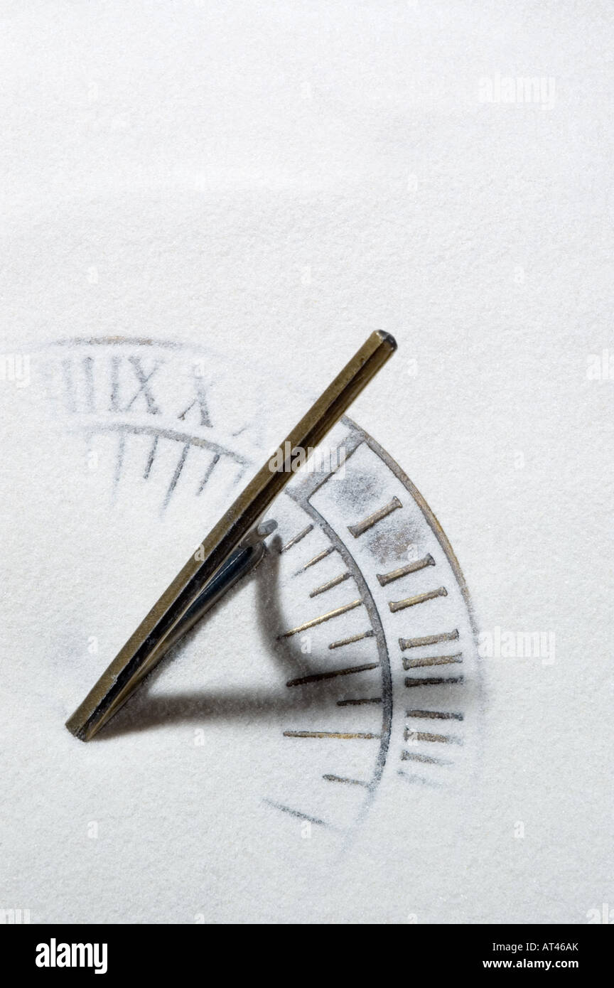 Sundial covered with sand Stock Photo - Alamy