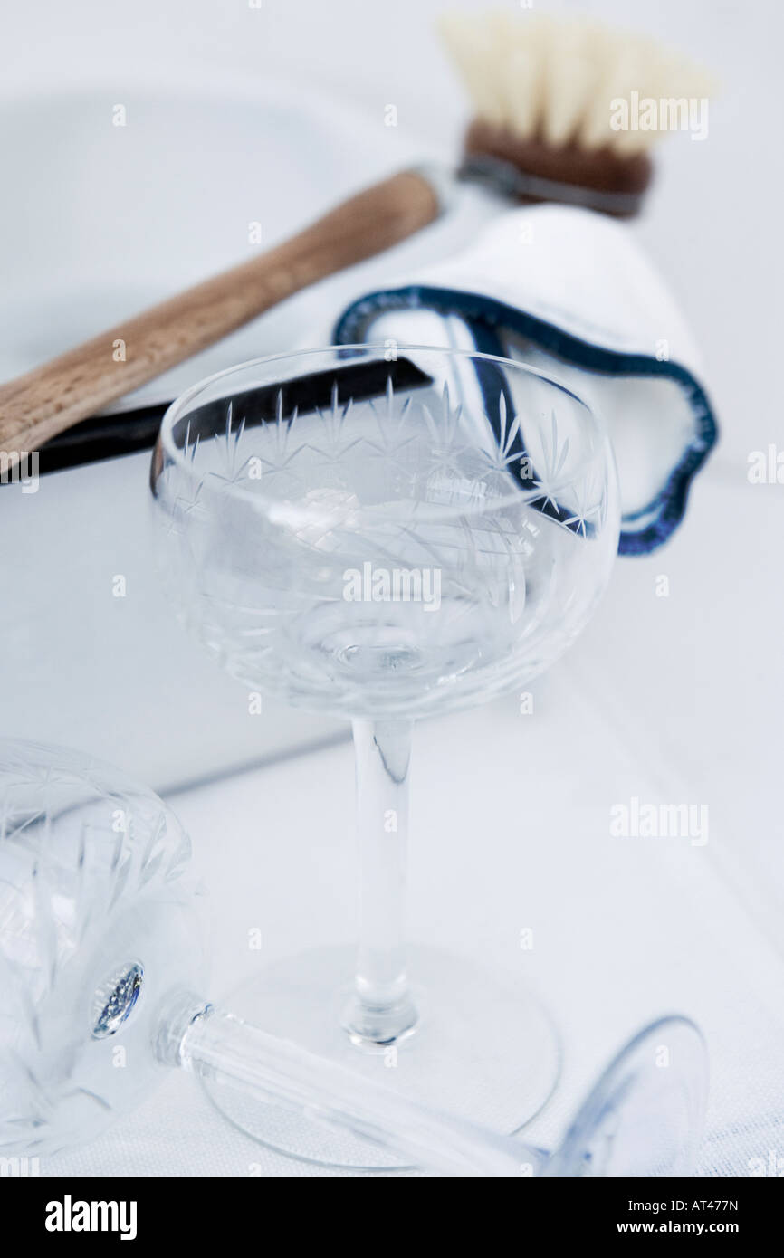 Enamel Washing up bowl and glassware Stock Photo - Alamy