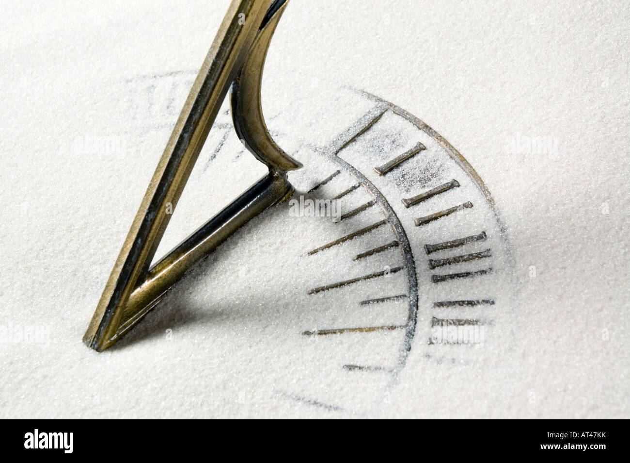 Sundial covered with sand Stock Photo - Alamy