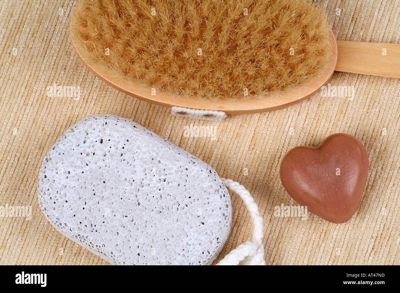 Bath brush, pumice stone and soap on cloth from high angle Stock Photo ...