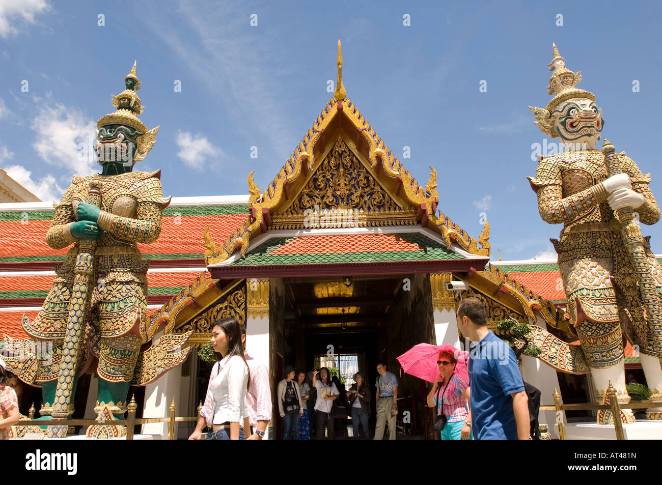 Large mythical beast statues guard the entrance to the Grand Palace ...